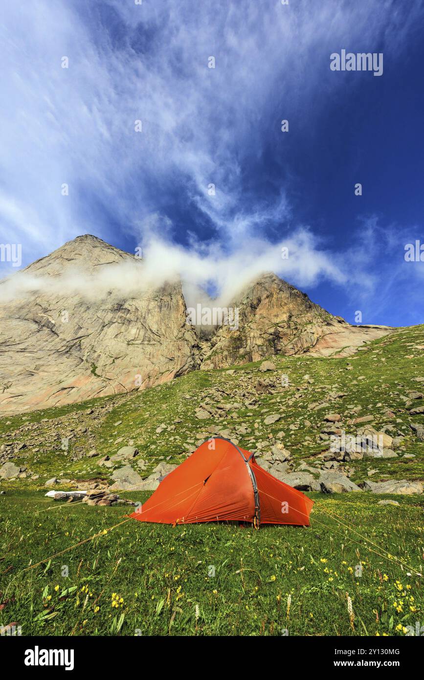 Tent at the foot of a rock face, Buneset, Moskenesoeya, Lofoten ...