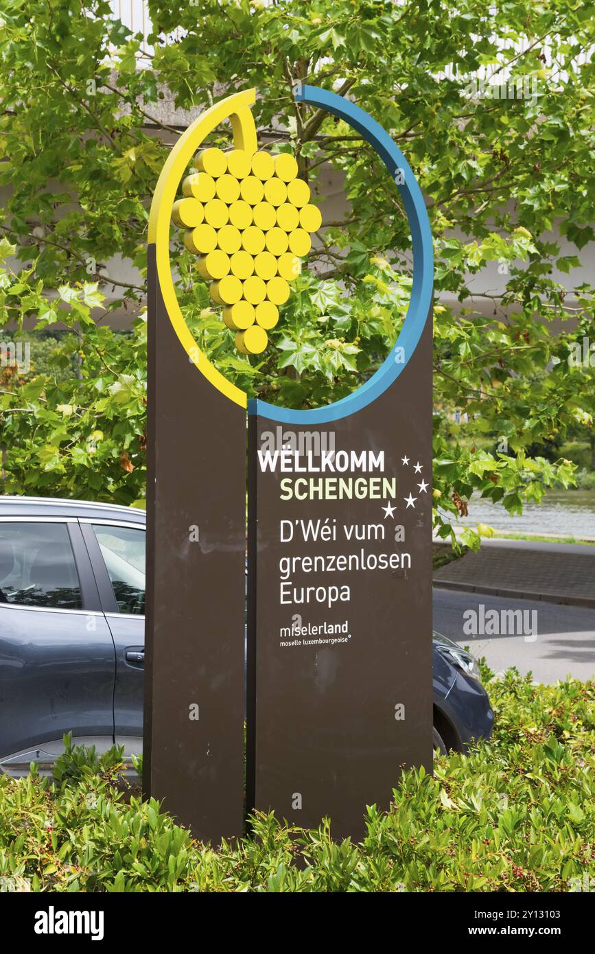 Welcome sign for Schengen with a graphic grape motif and green ...