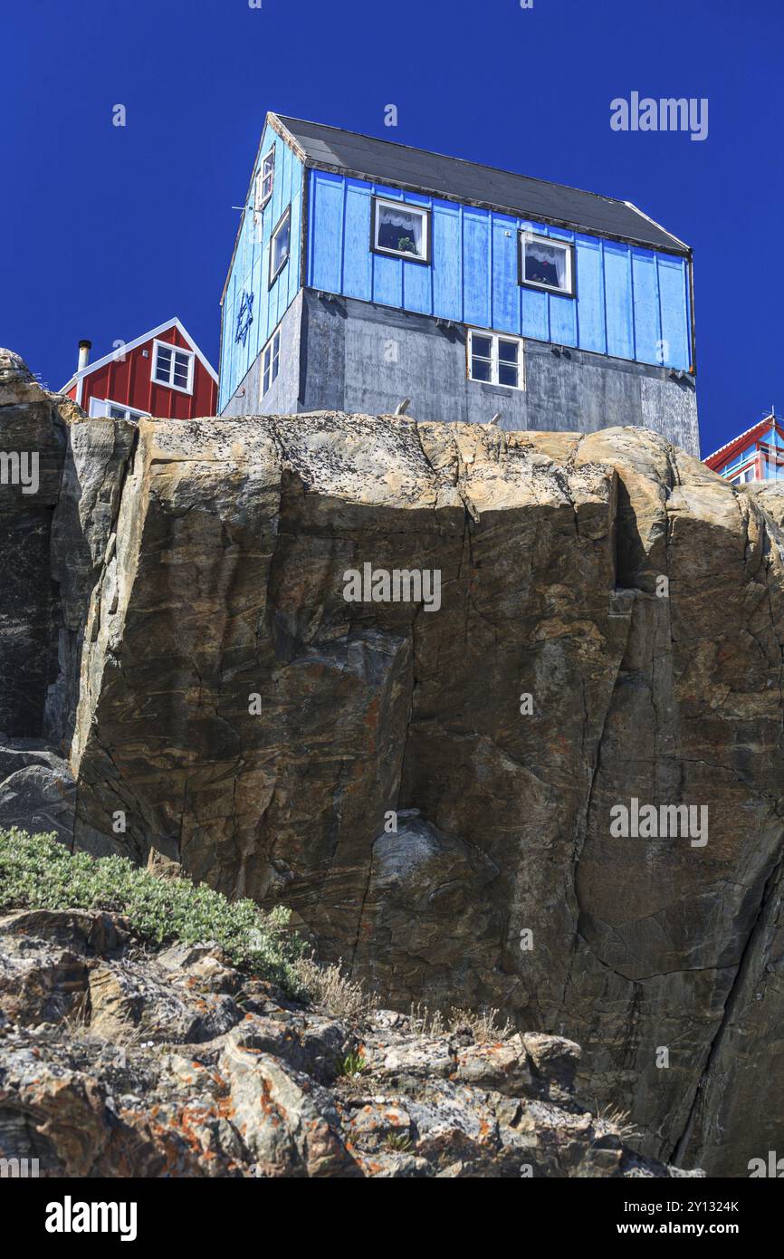 Typical Greenlandic house on a rock, sunny, Uummannaq, West Greenland ...