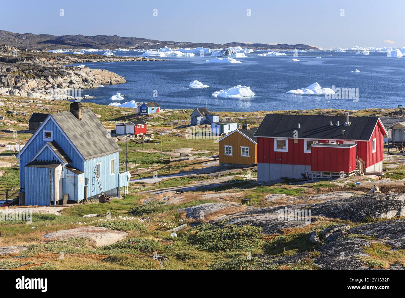 Typical Greenlandic houses, Inuit settlement in front of icebergs ...