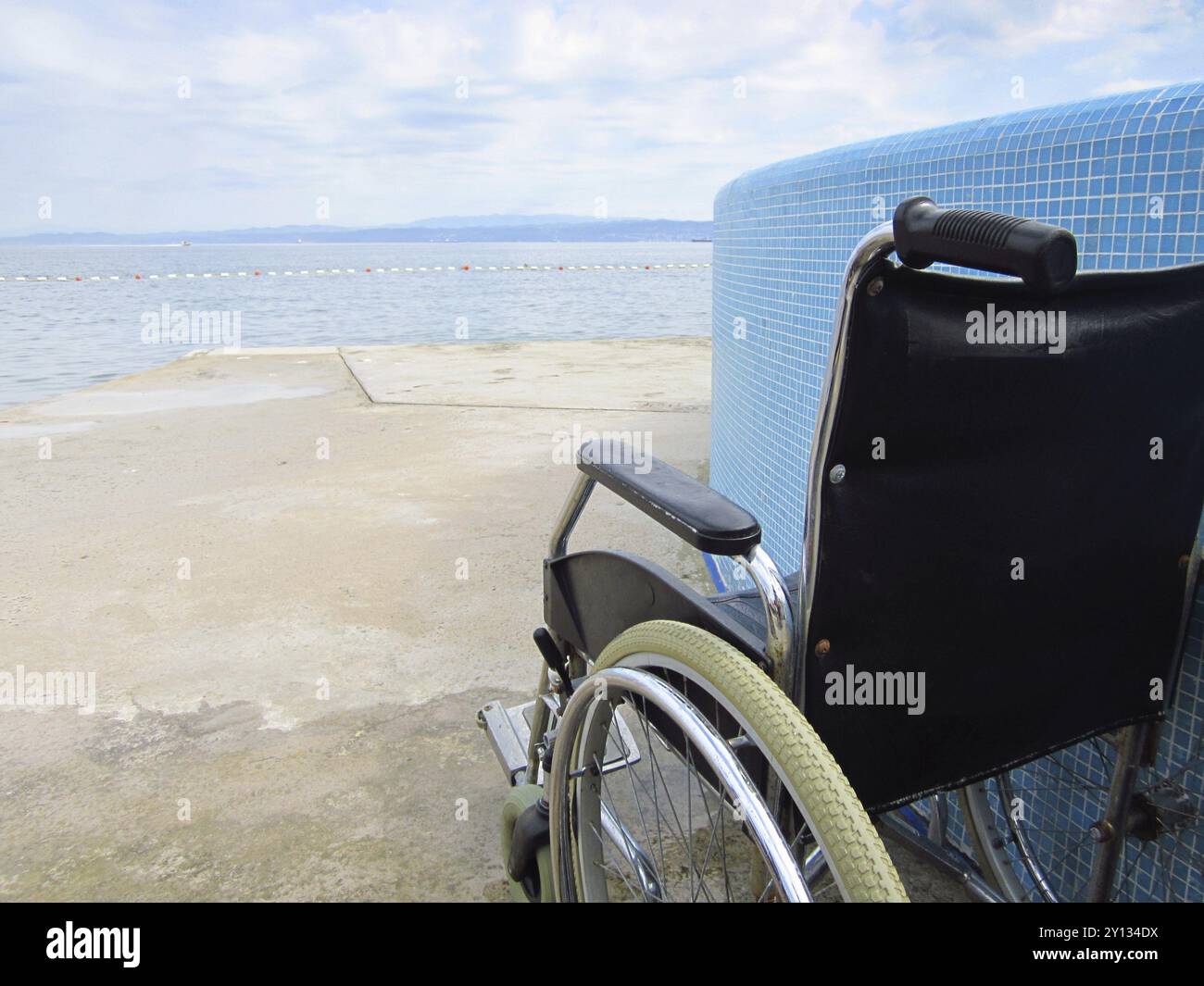 Disability help on the beach hi-res stock photography and images - Alamy
