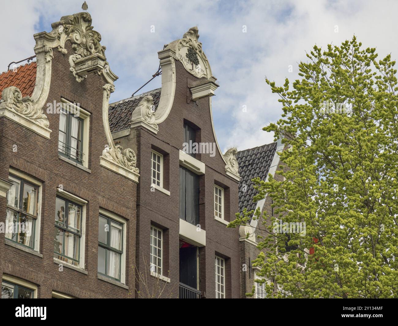 Typical historic buildings with distinctive gables and windows under a ...