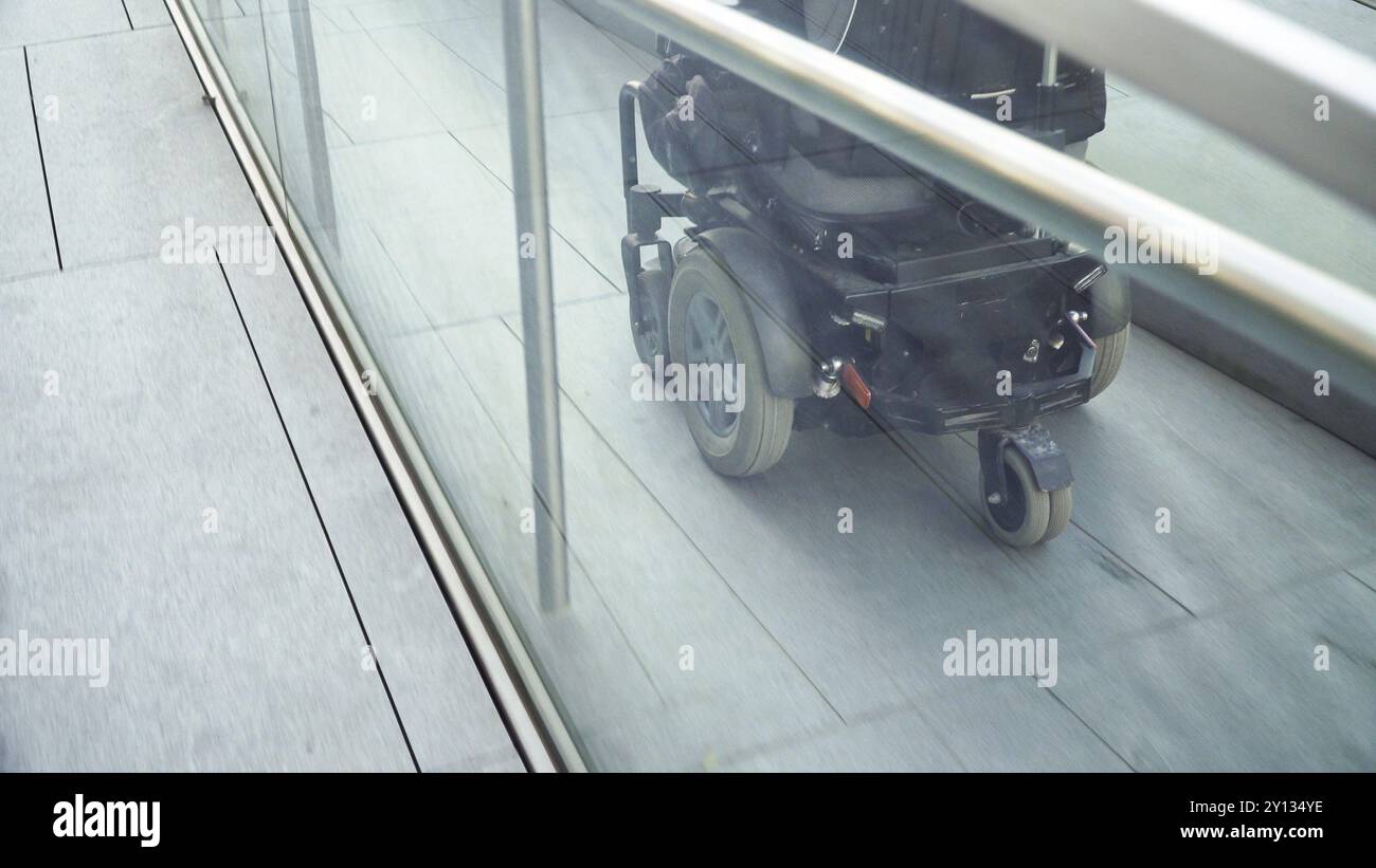 Man on electric wheelchair using a ramp. Accessibility concept Stock ...