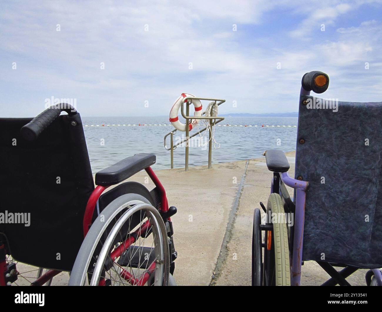 Wheelchairs on an accessible beach for transportation of people with ...