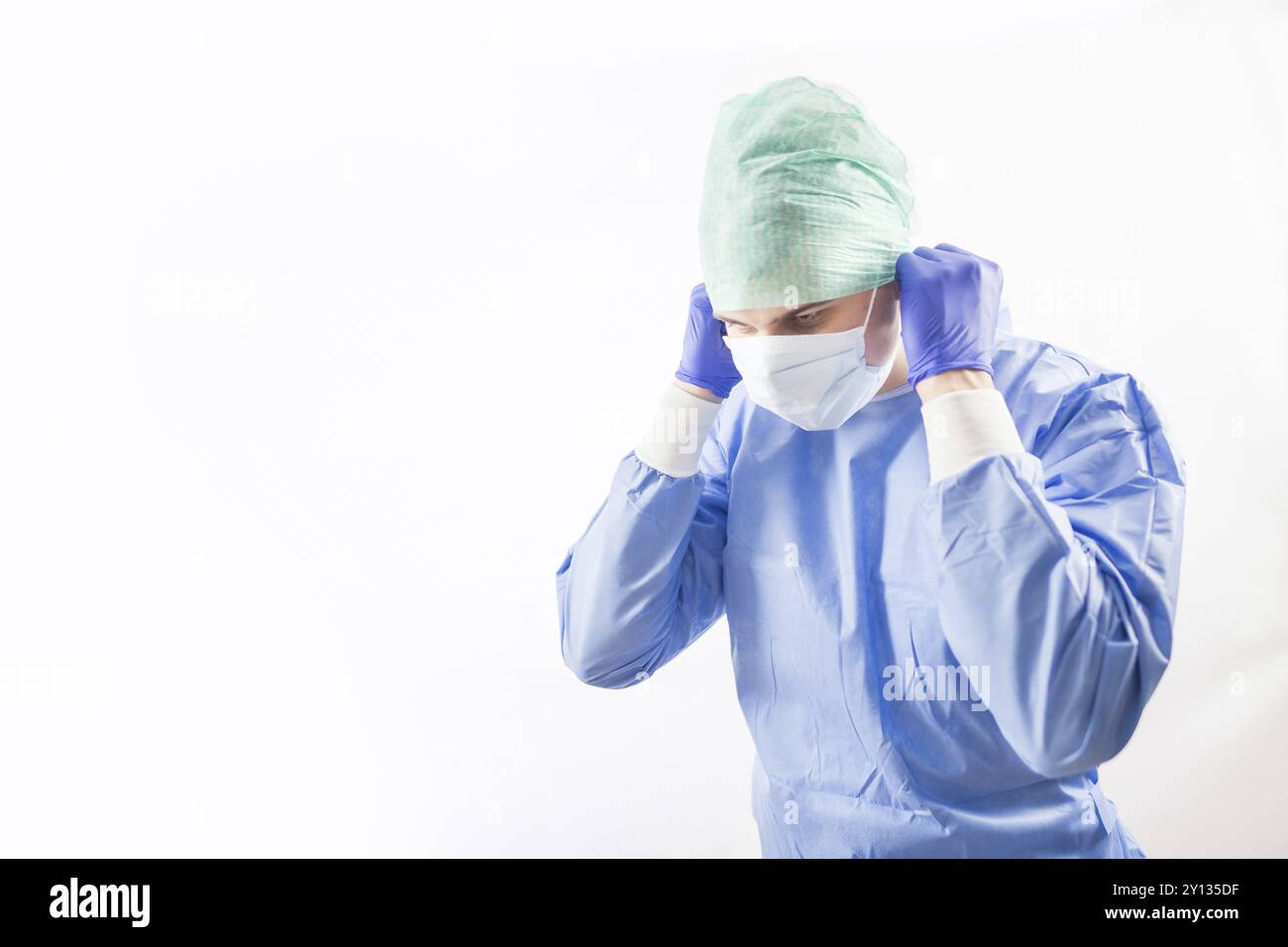 Surgeon doctor in sterile gloves preparing for operation in hospital ...