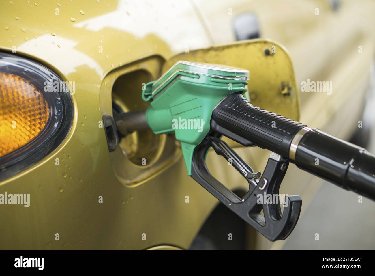 Closeup photo of car at gas station being filled with fuel Stock Photo ...