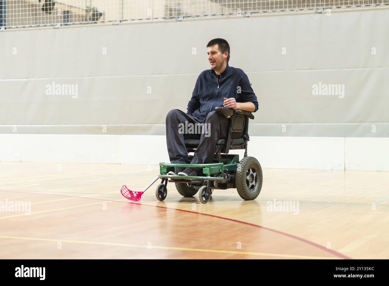Photo of disabled man on a wheelchair playing sports, hockey ...