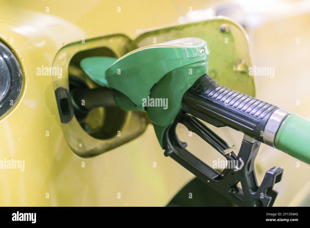 Closeup photo of car at gas station being filled with fuel Stock Photo ...