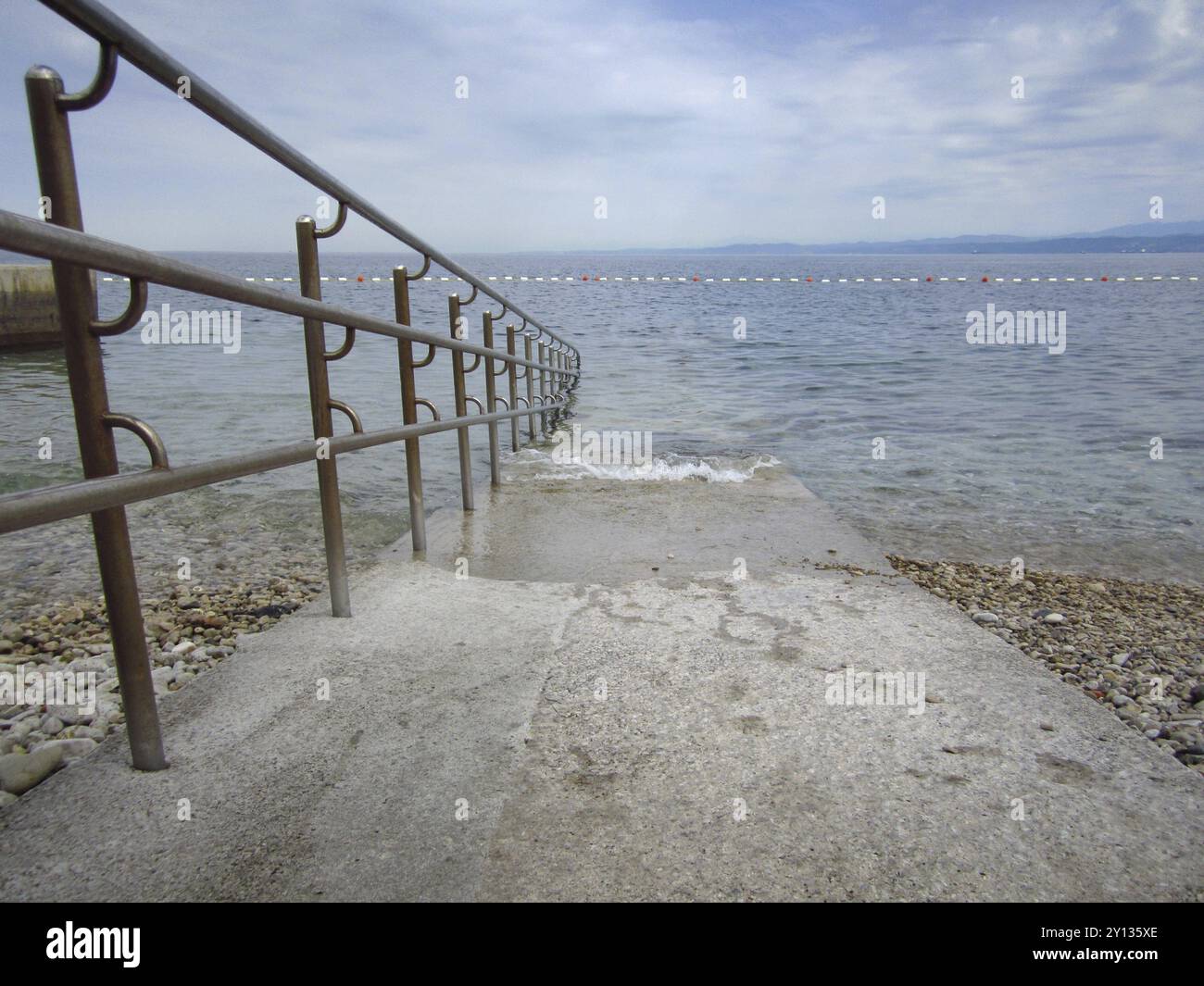 Accessible wheelchair ramp into the sea water to be used by people with ...