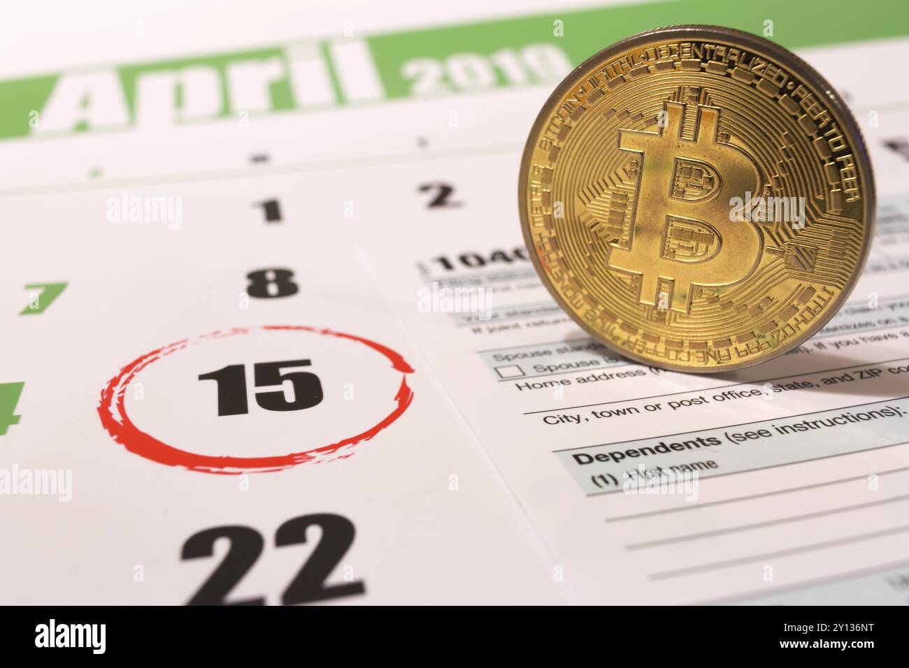 Bitcoin and 2019 calendar with 1040 income tax form for 2018 showing ...
