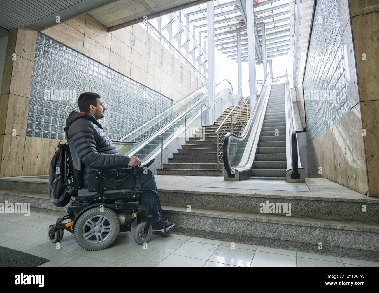 Rear View Of A Disabled Man On Wheelchair In Front Of Staircase Stock ...