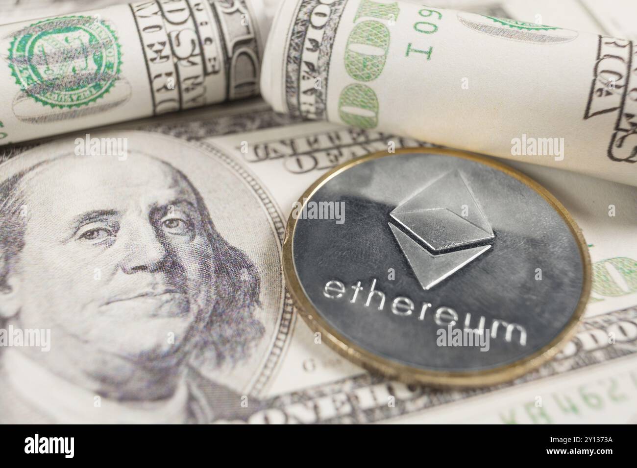 Ethereum crypto coin on dollar notes background Stock Photo - Alamy