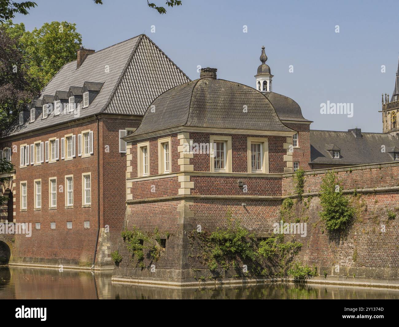 Historic castle with striking brick architecture and towers, surrounded ...