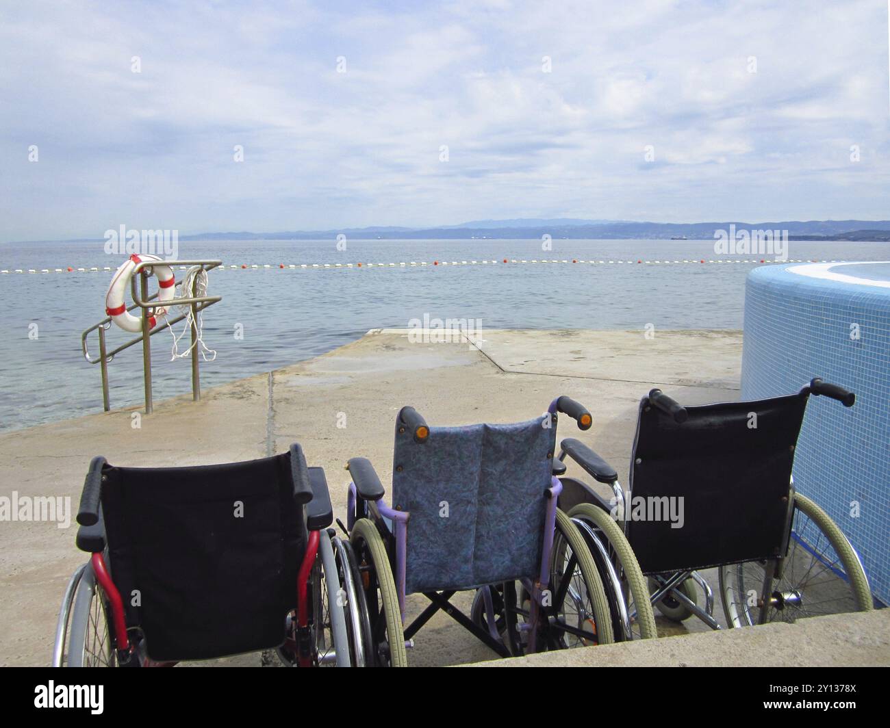 Wheelchairs on an accessible beach for transportation of people with ...