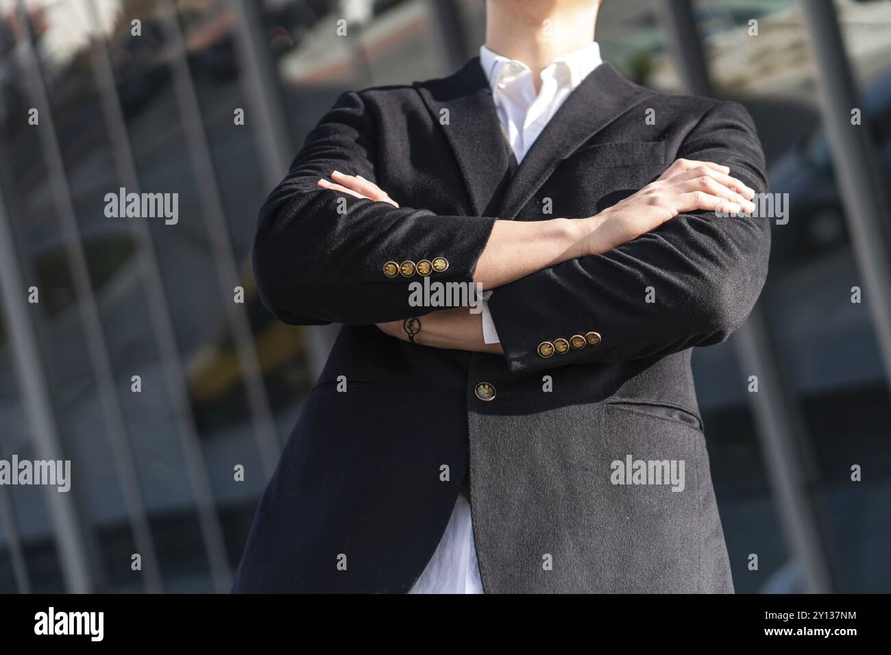 Photo of business man in classic black suit, shirt holding hands folded ...