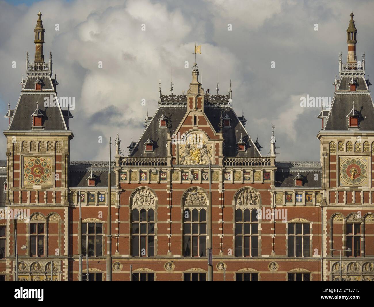 Imposing building with towers and detailed facade under a cloudy sky ...