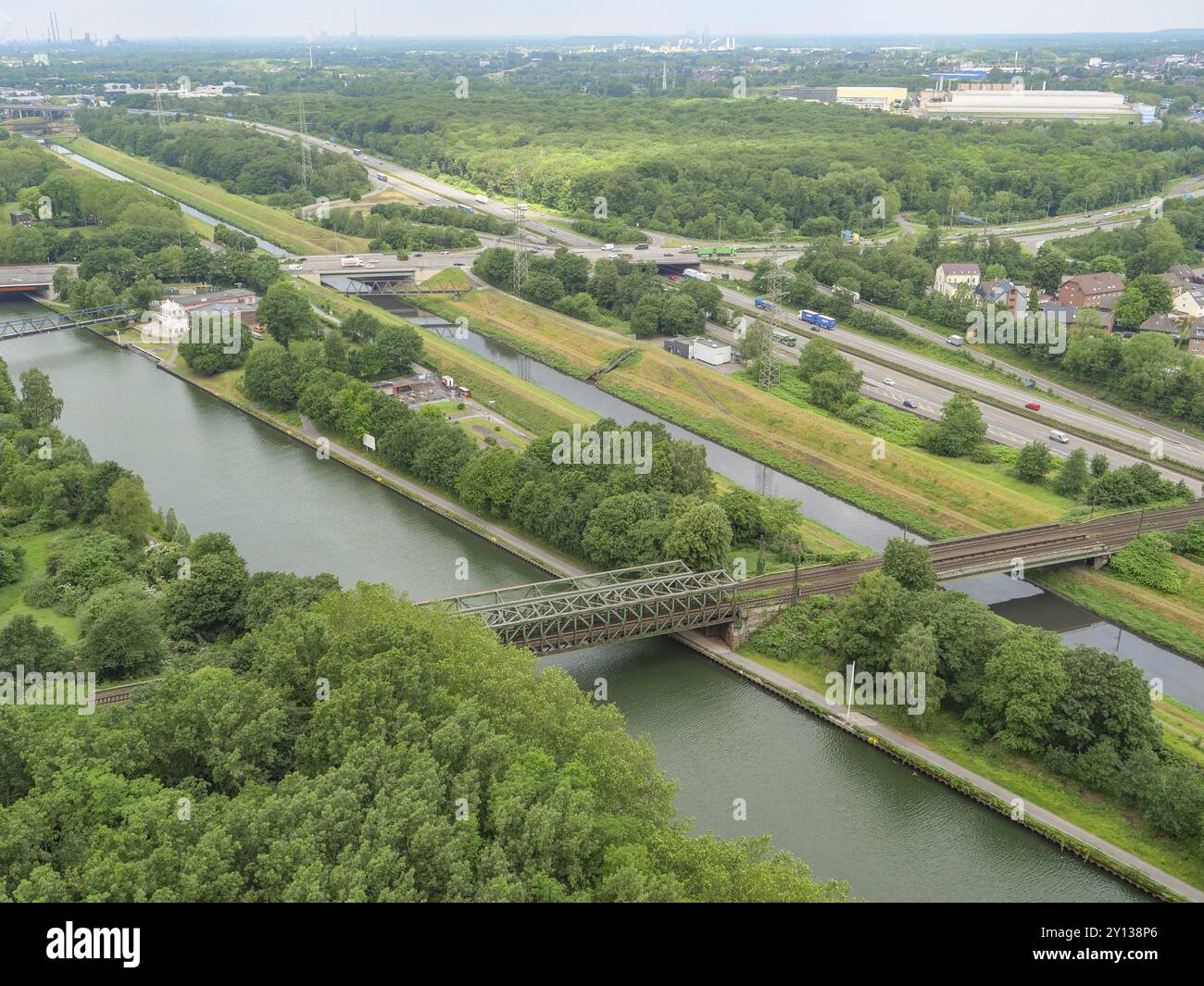 Wide canal with several bridges, border to the cityscape and motorway ...