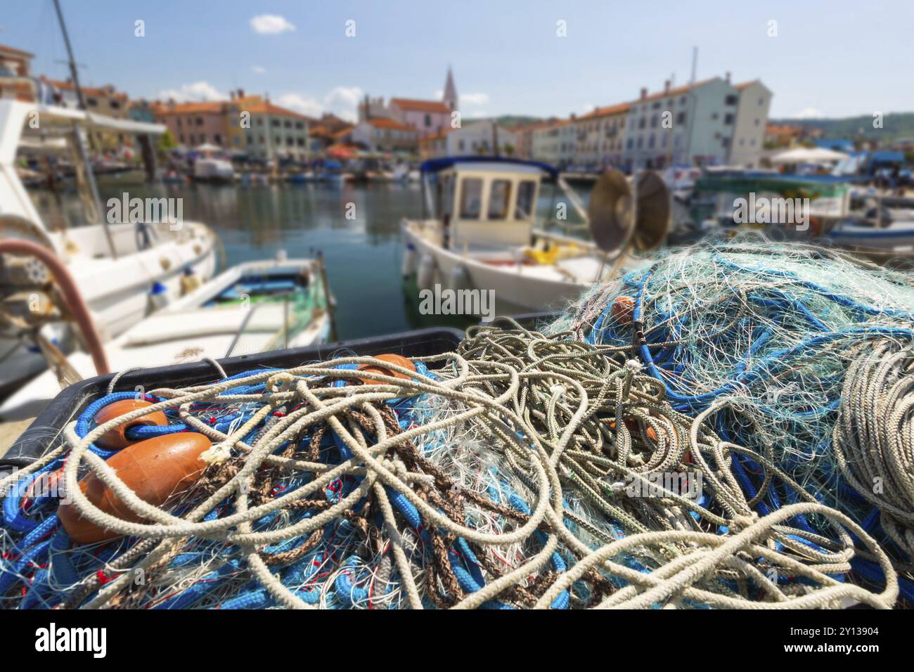 Scenic harbour with boats and brightly coloured houses on the fishing ...