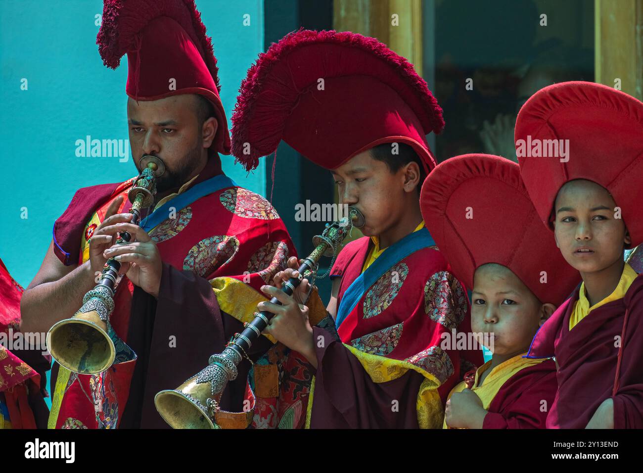 Ladakhi monks wearing traditional outfits and playing musical ...