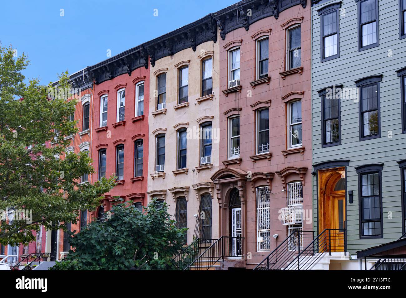 New York City, row of old townhouses in alternating colors Stock Photo ...