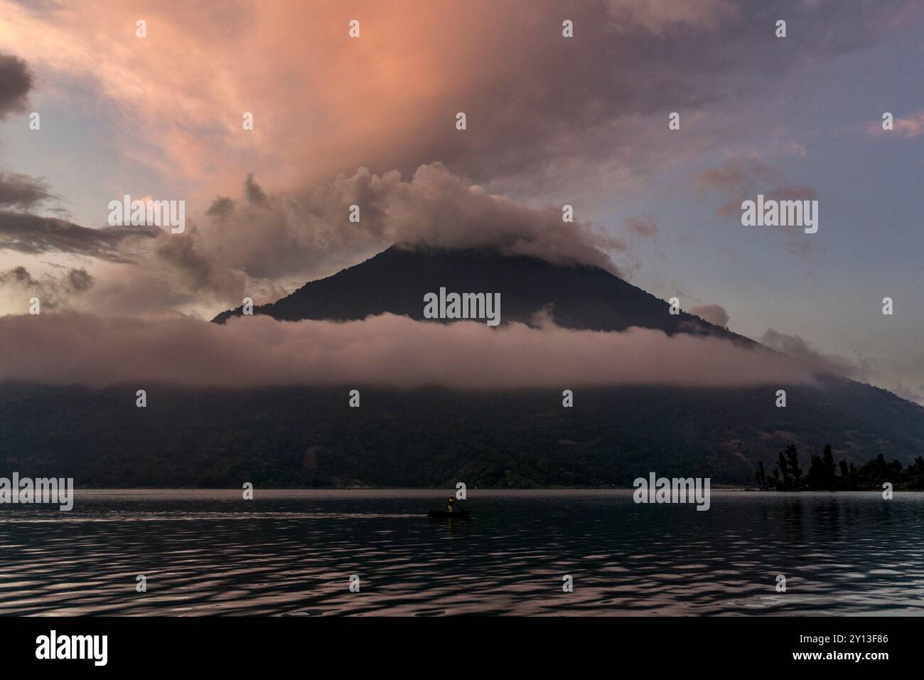 Tourists on a mooring enjoying the sunset, Lake Atitlan and San Pedro ...