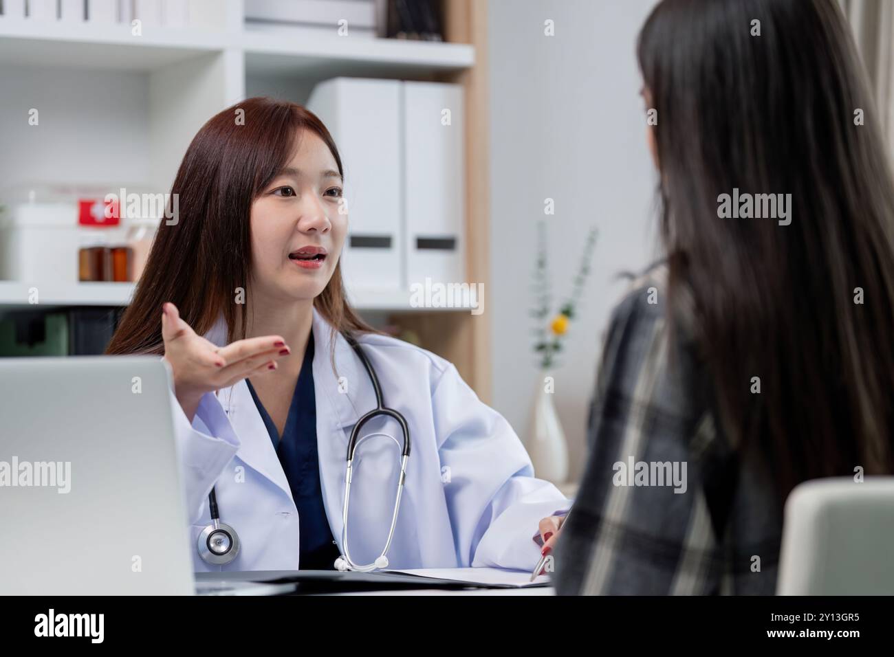 Medical consultation between female doctor and patient Stock Photo - Alamy
