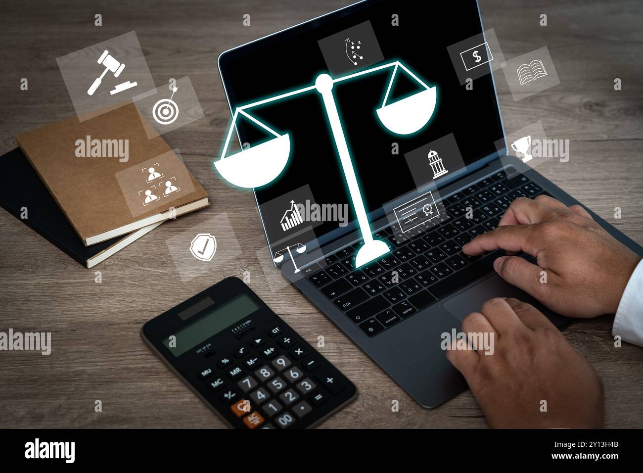 laptop computer with legal law scale Male judge working on laptop ...