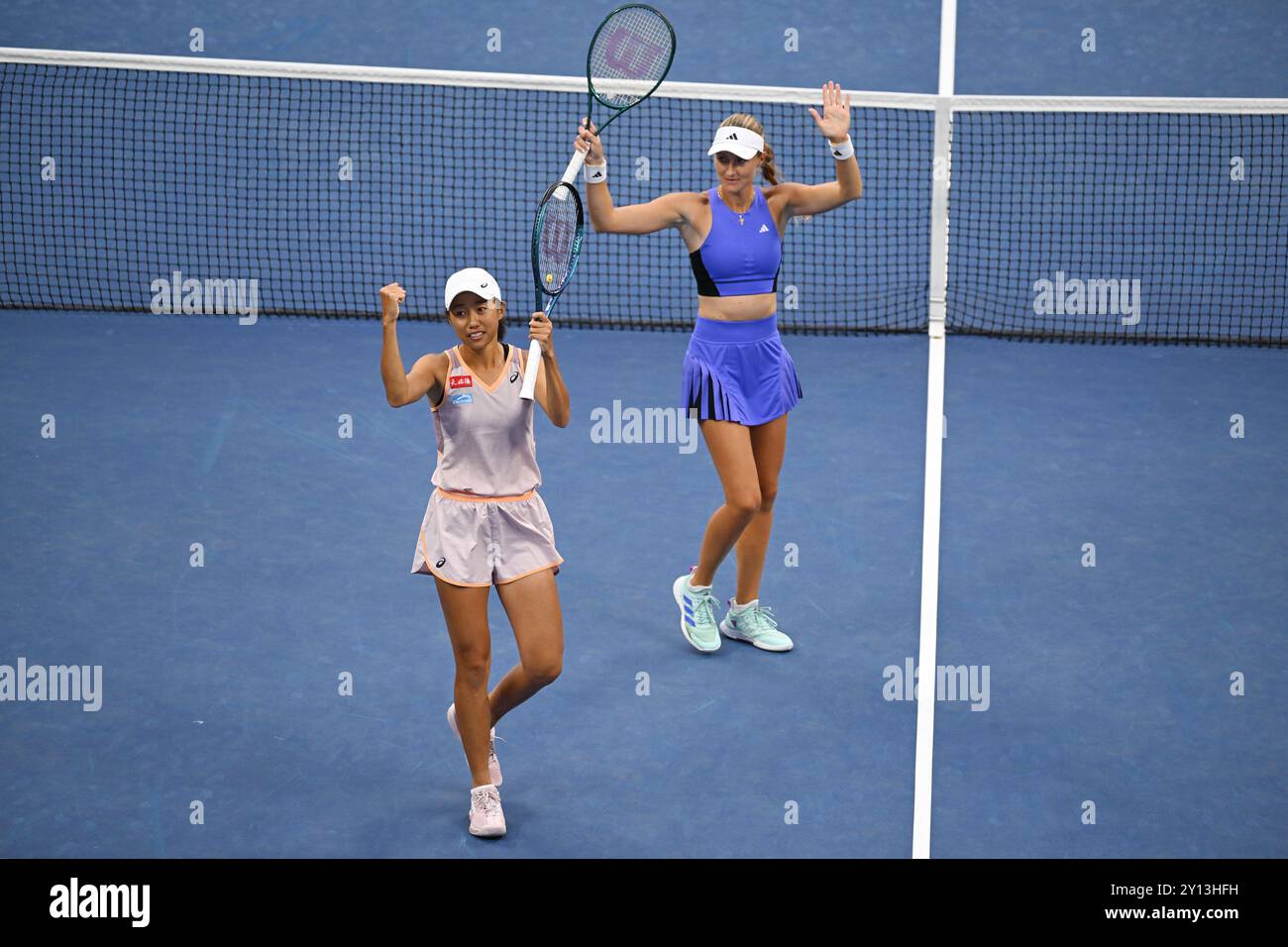 New York, USA. 4th Sep, 2024. Zhang Shuai (L) and Kristina Mladenovic celebrate after the women ...