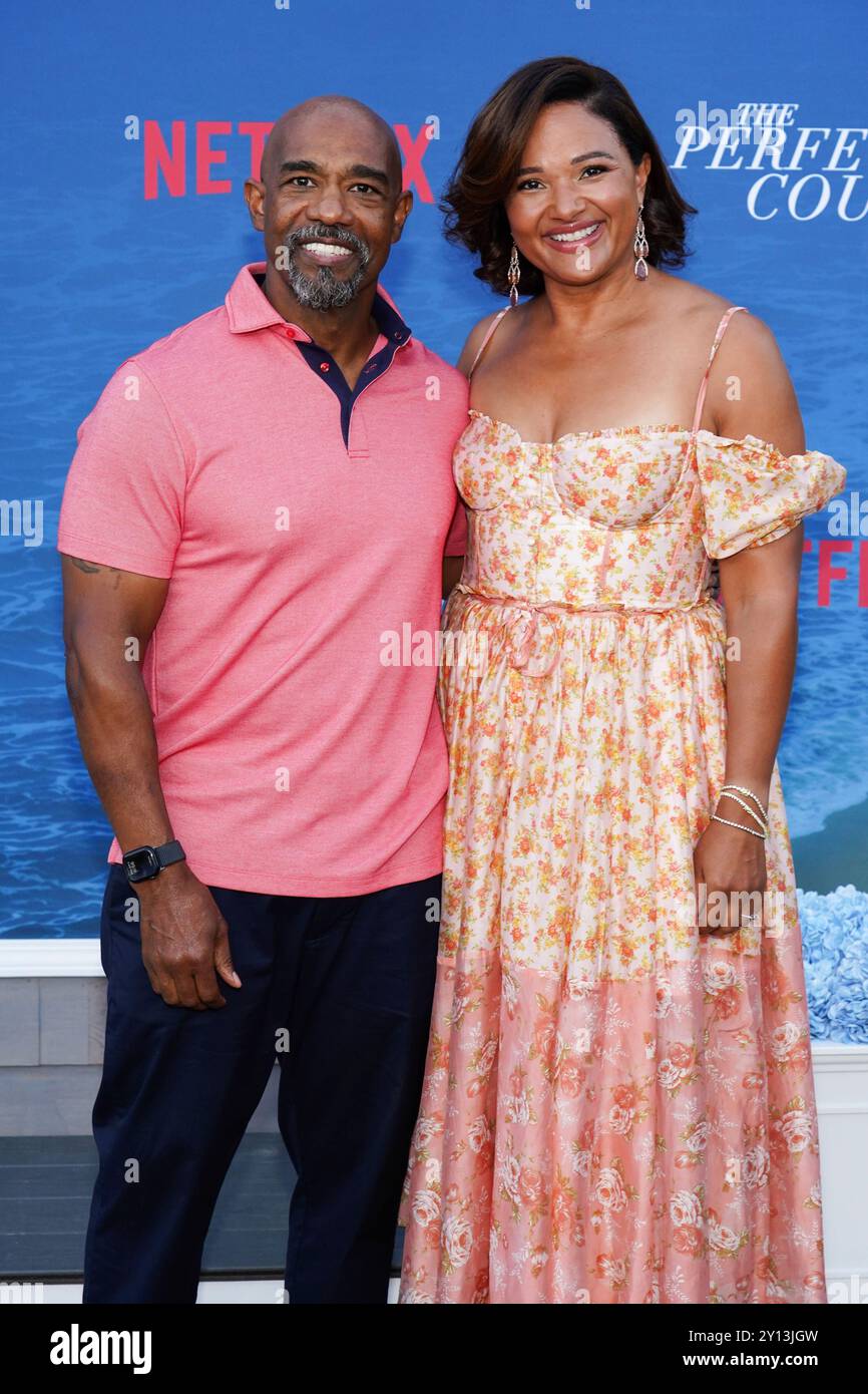 Michael Beach, left, and Elisha Wilson Beach arrive at the premiere of "The Perfect Couple" on ...