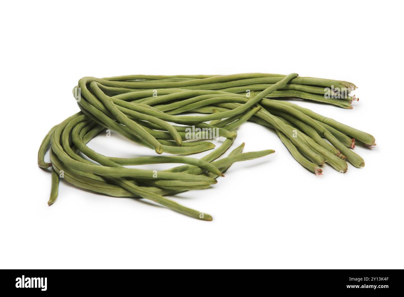 A bunch of fresh long green beans, also known as yardlong beans ...