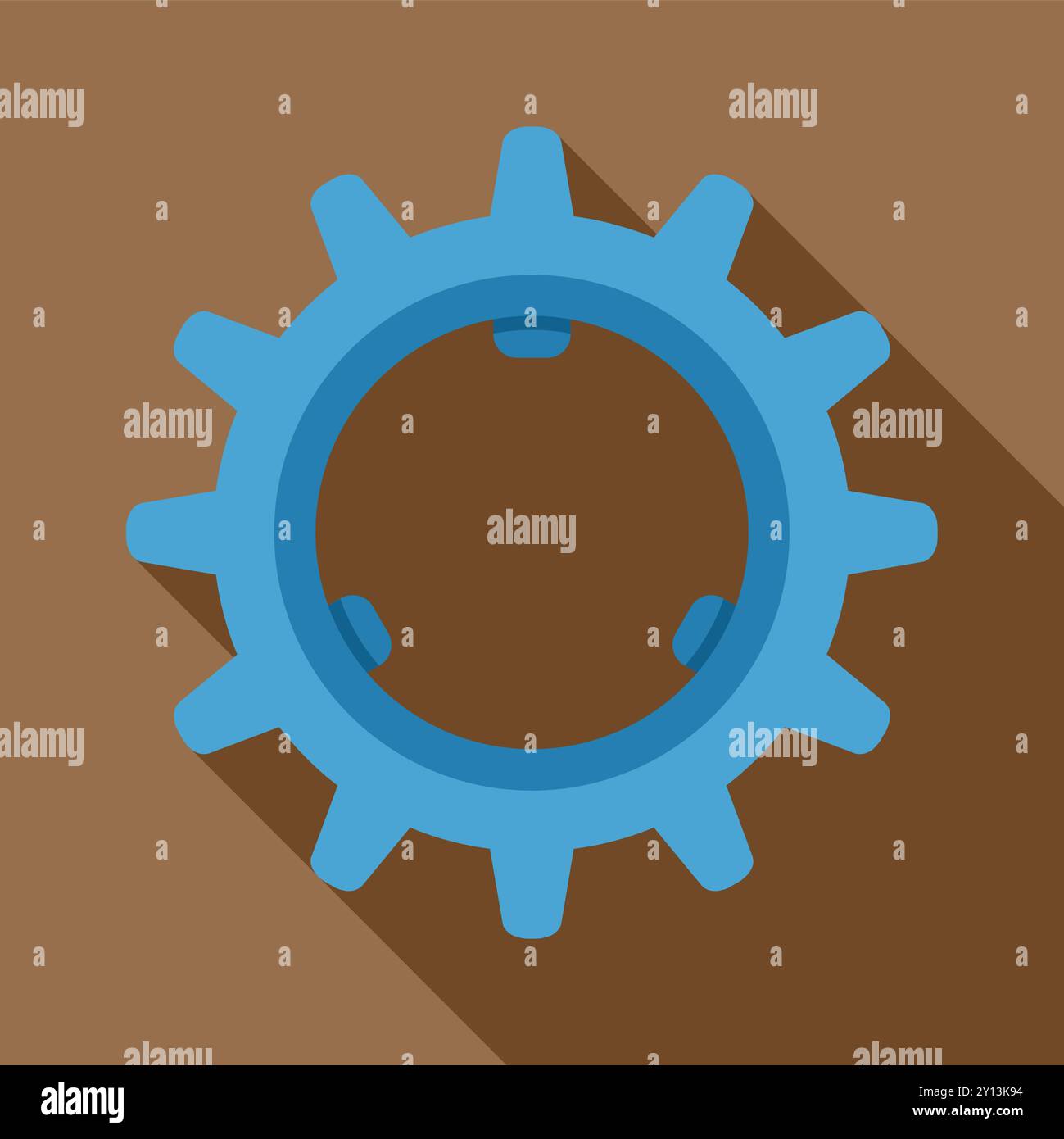 Blue gear wheel casting a long shadow on brown background, simple ...