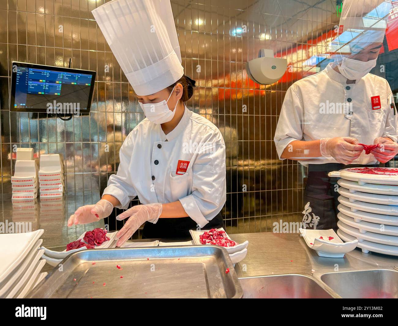 Shanghai, CHina, Chinese Chefs in Butcher Shop, Preparing Meats for ...