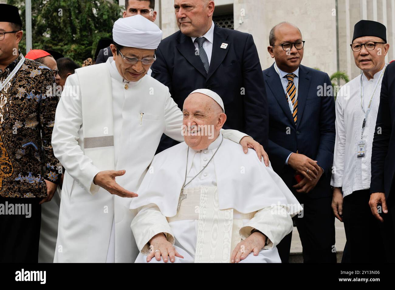 The Grand Imam of Istiqlal Mosque Nasaruddin Umar, left, reach out to ...
