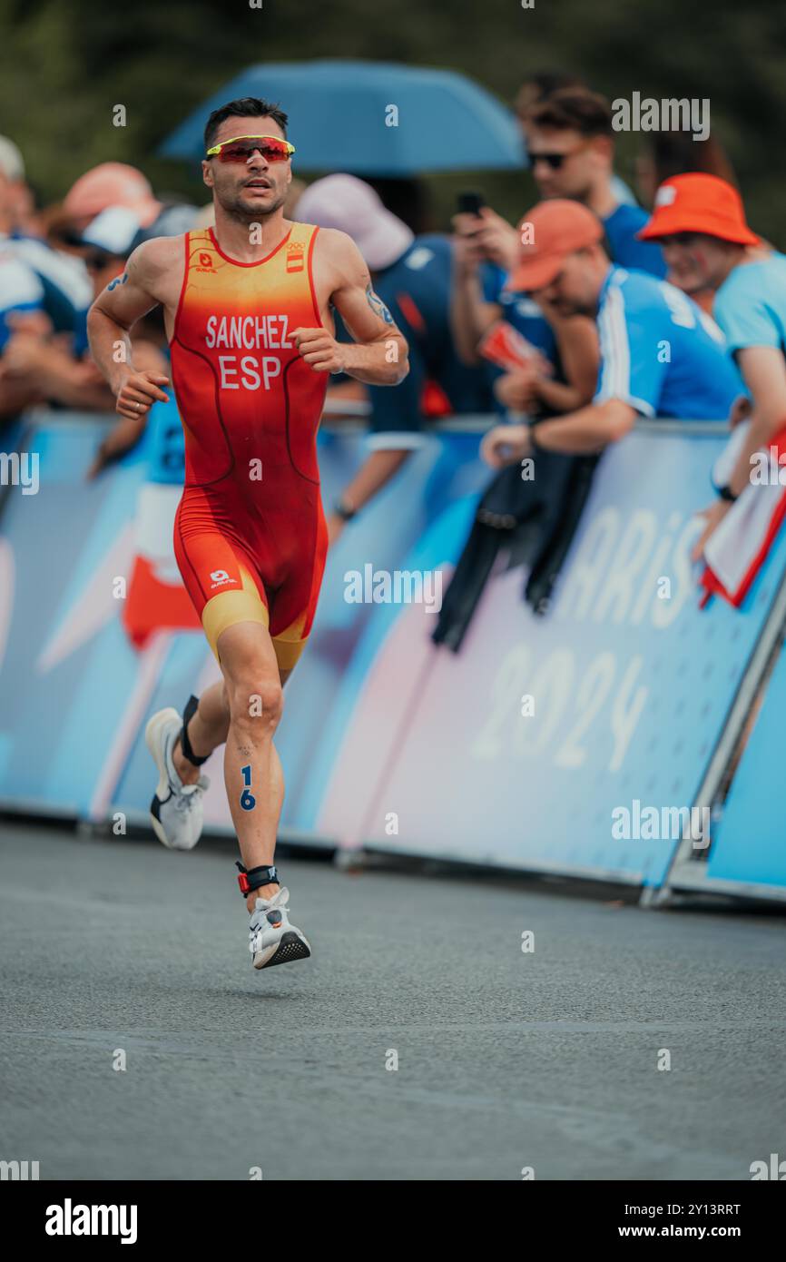 Roberto Sanchez Mantecon participating in the triathlon at the Paris ...