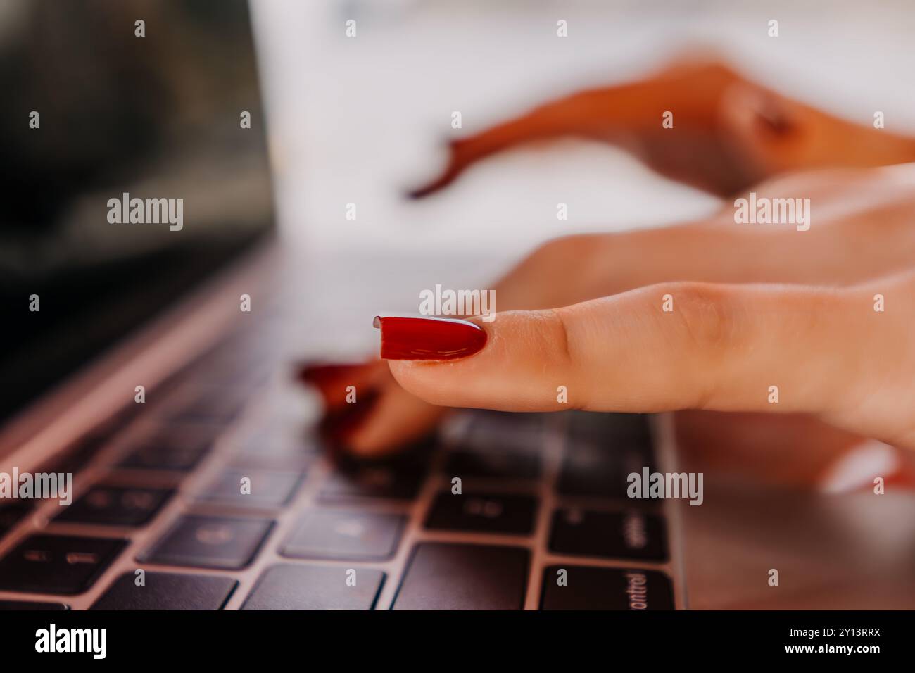 Hands Typing Laptop Keyboard Close Up - Woman's hands with red nail polish typing on a laptop ...