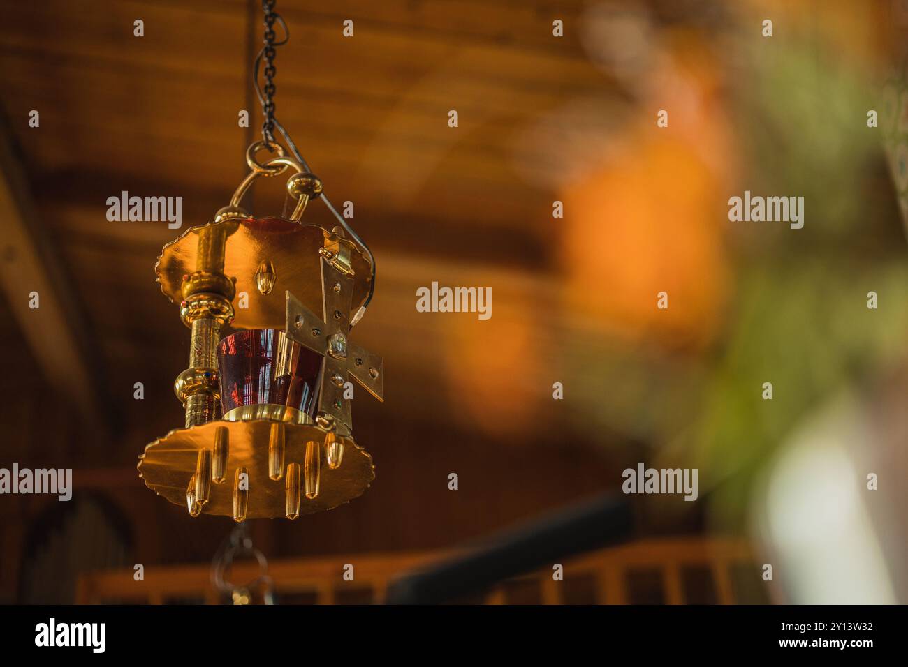 Brass metal lantern with a cross hanging from the ceiling Stock Photo ...