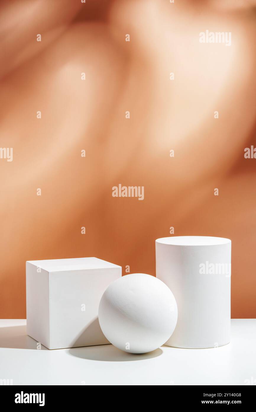 White geometric shapes arranged stylishly on a soft peach background in ...