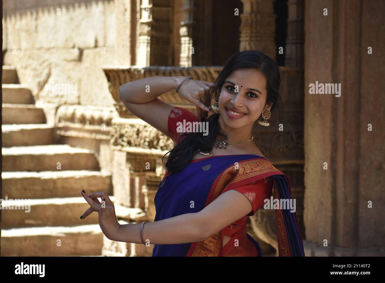 Female Bharatanatyam dancer posing in the temples of Gujarat, India ...