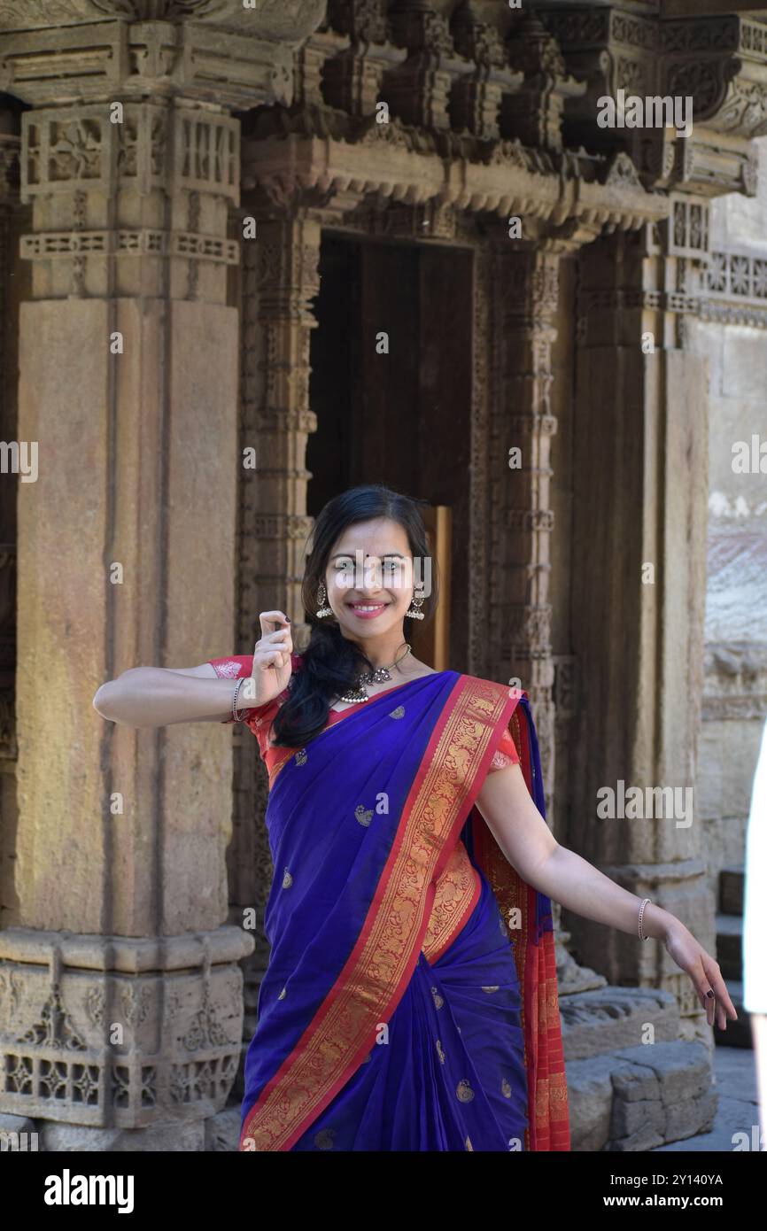 Female Bharatanatyam dancer posing in the temples of Gujarat, India ...