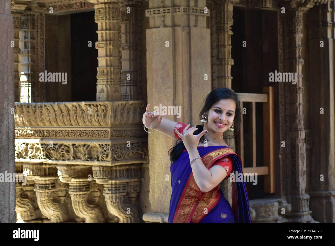 Female Bharatanatyam dancer posing in the temples of Gujarat, India ...