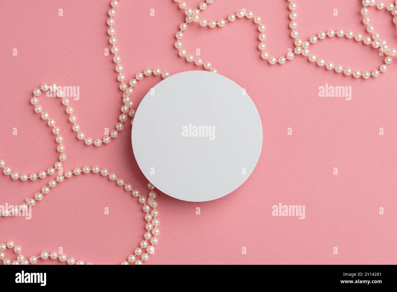Elegant Round White Surface Surrounded by String of Pearls on Soft Pink ...