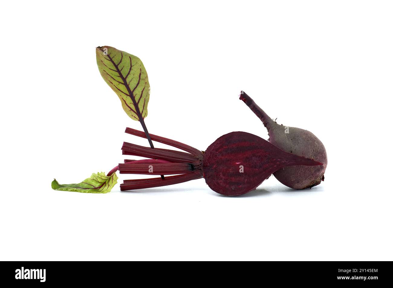 Fresh beetroot with vibrant red color and green leaves on a white ...
