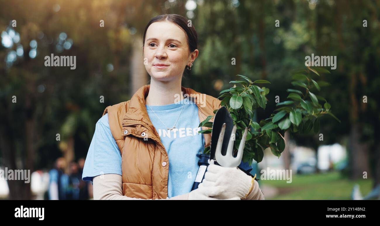 Conservation, smile and thinking with volunteer woman outdoor in park ...