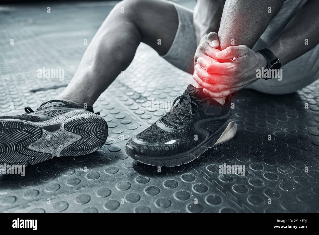 Ankle pain, fitness and injury with person on floor of gym for accident ...