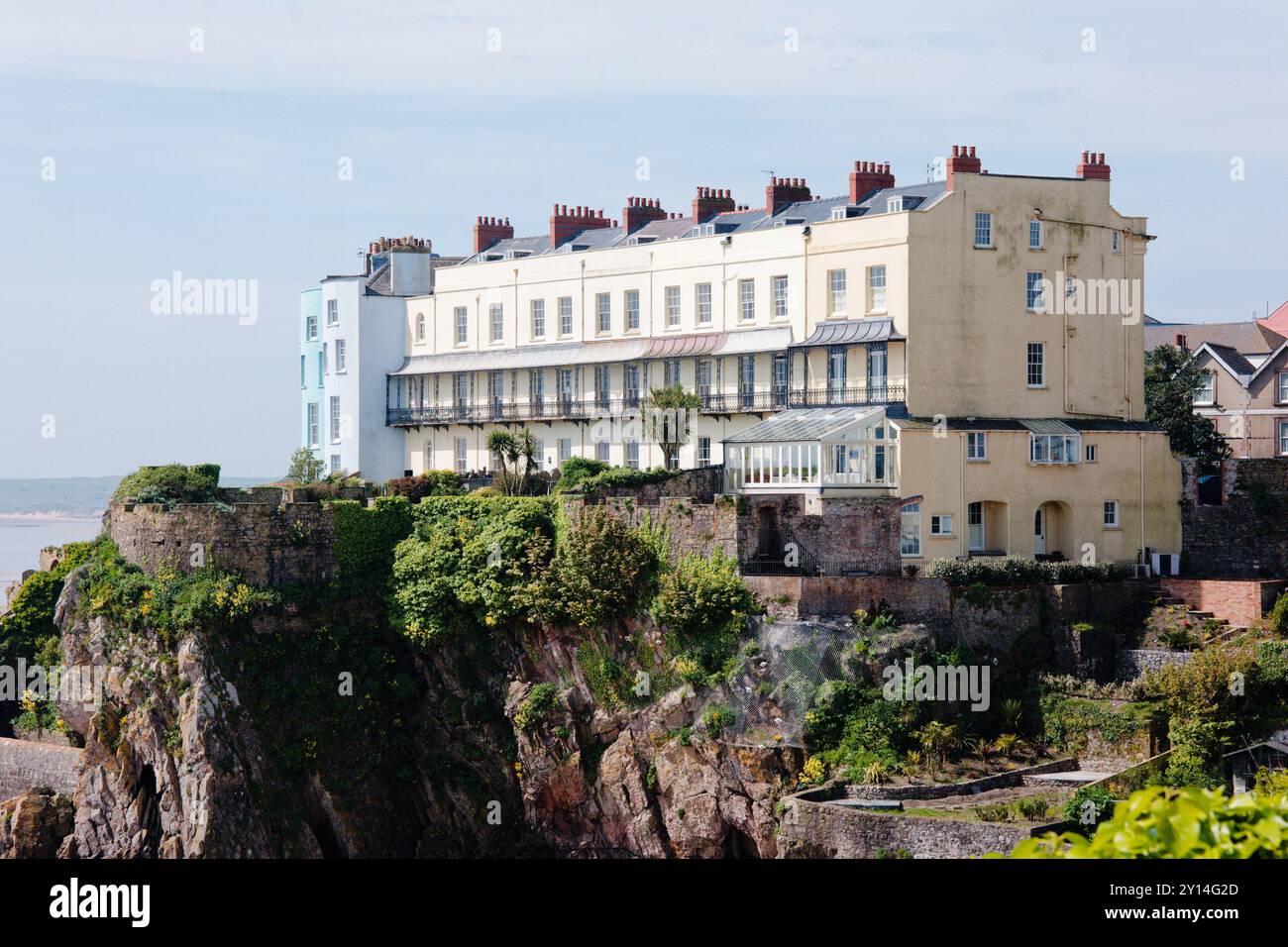 A terrace of houses on old castle fortifications above the beaches of ...
