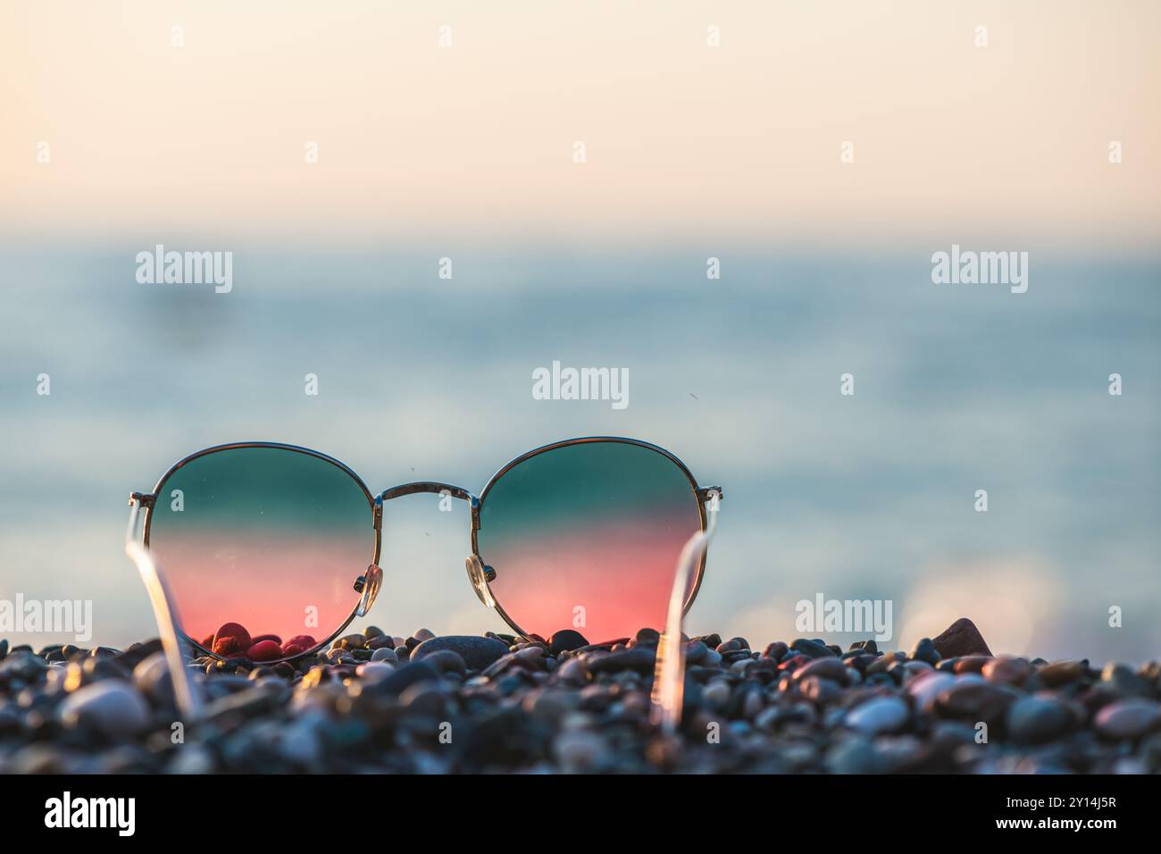 Colorful bright sunglasses on the background of the sea, concept summer ...
