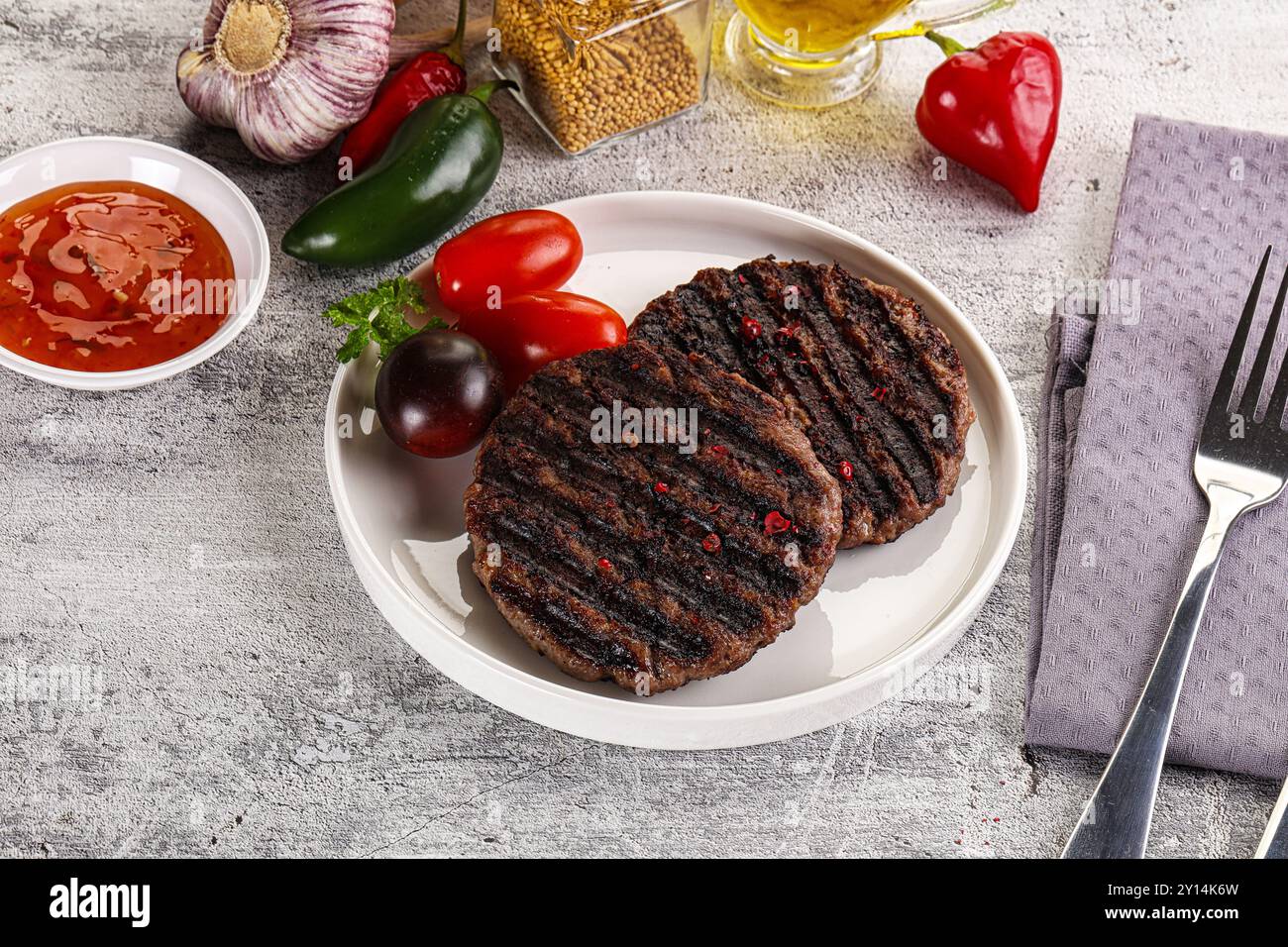 Grilled beef burger cutlet with sauce Stock Photo - Alamy