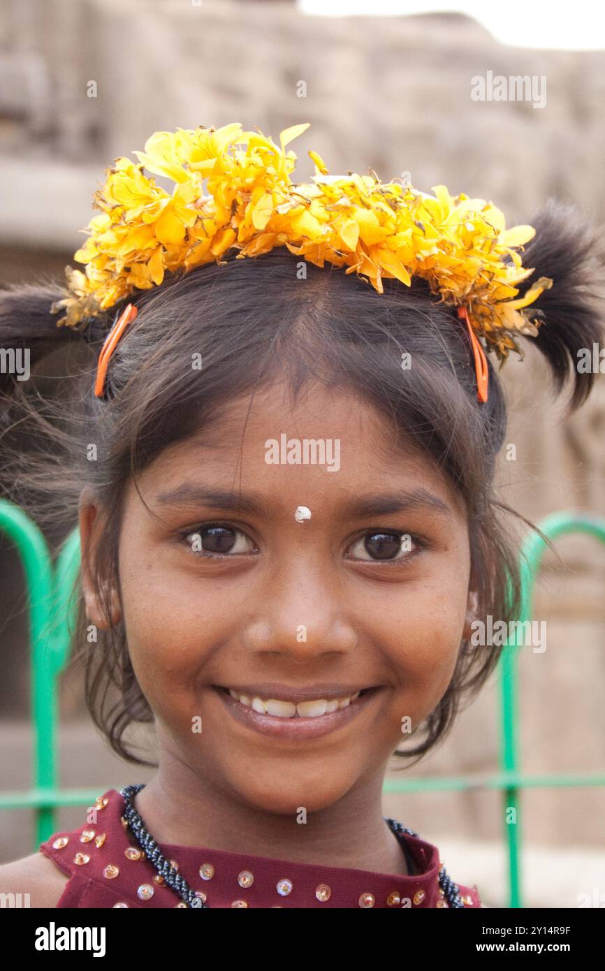 Young girl with flowers in her hair and a beautiful smile ...
