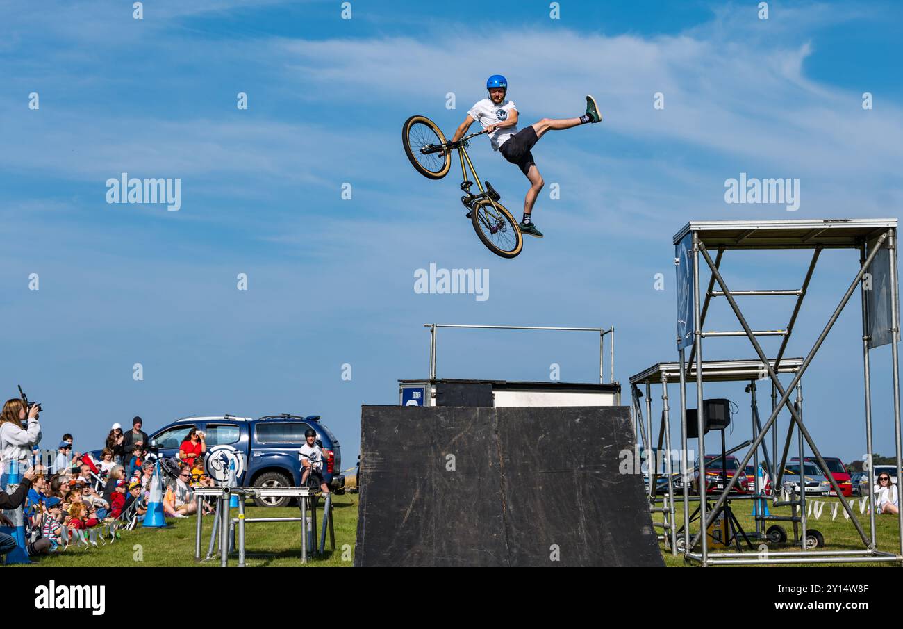 The Clan stunt cyclist performing a leap on a bike at 360 Fest ...