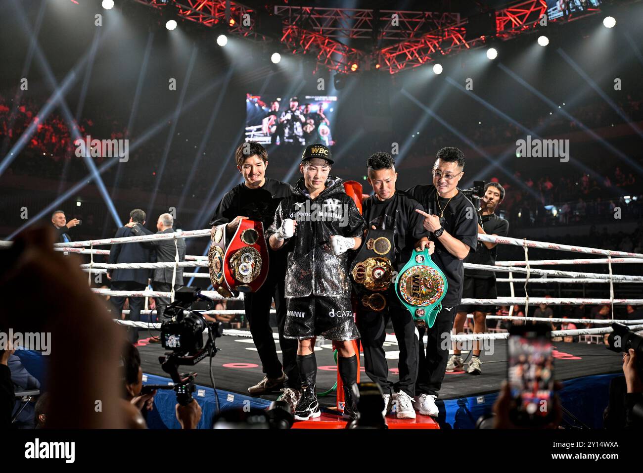 Japanese champion Naoya Inoue, second left, poses with his cousin Koki Inoue, left, brother ...